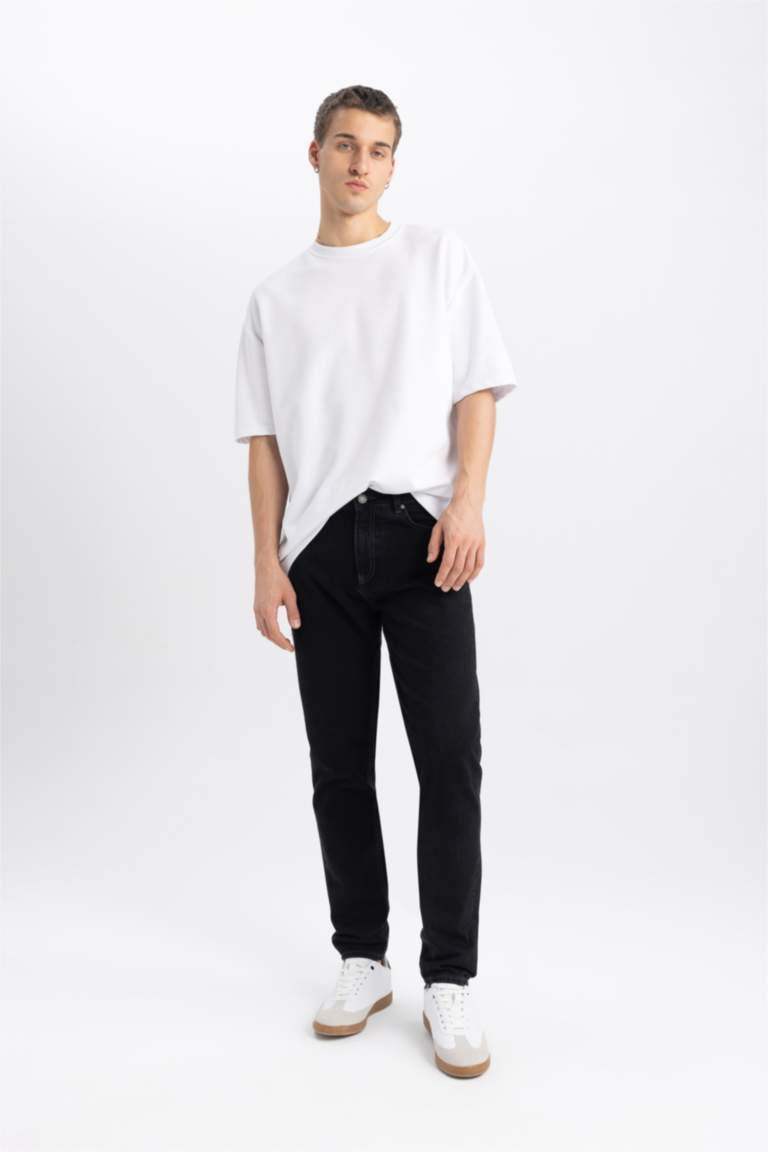 Black MAN Regular Tapered Fit Trousers 2996970 | DeFacto